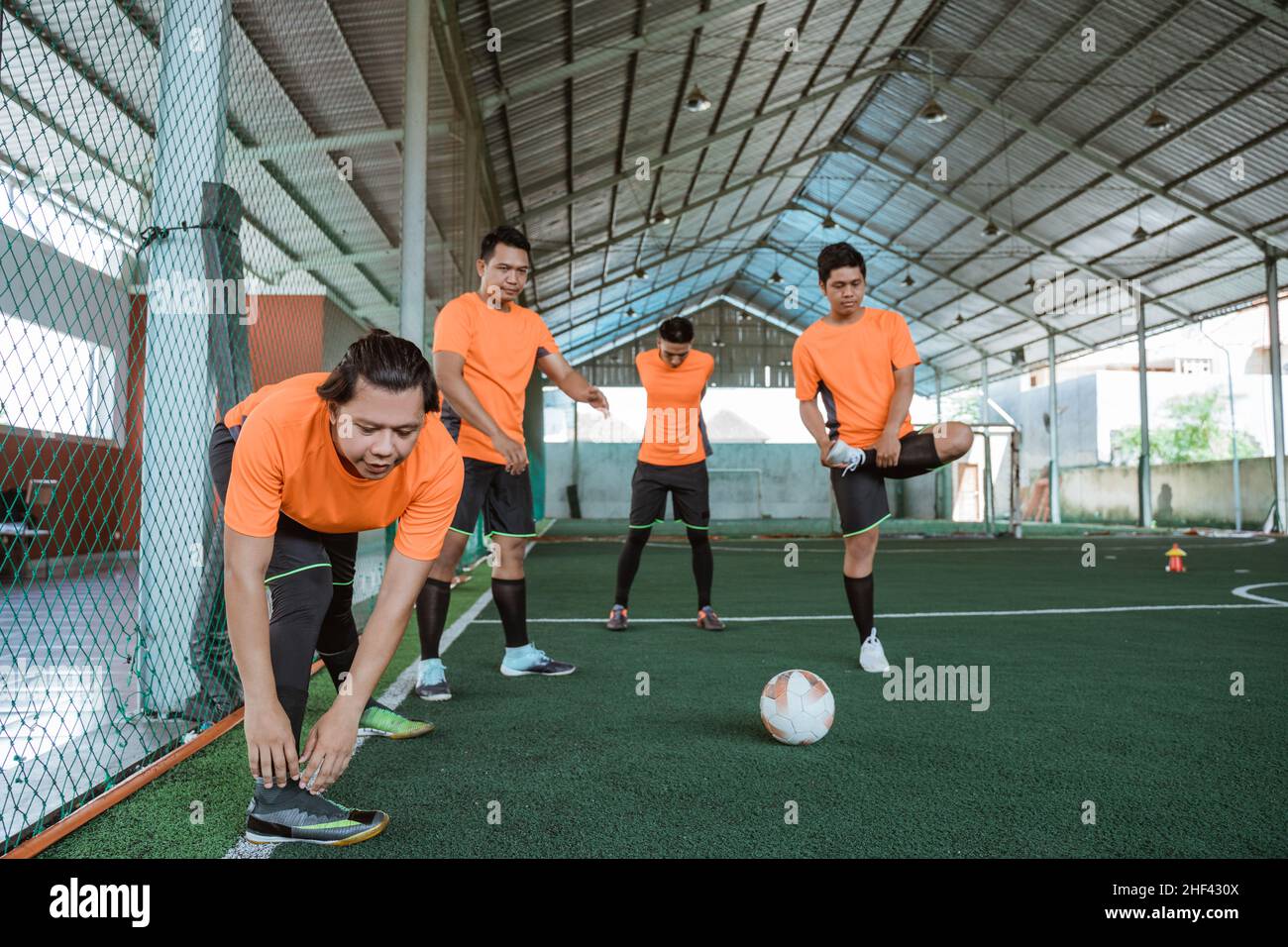 futsal players stretch with the team before the futsal match Stock ...