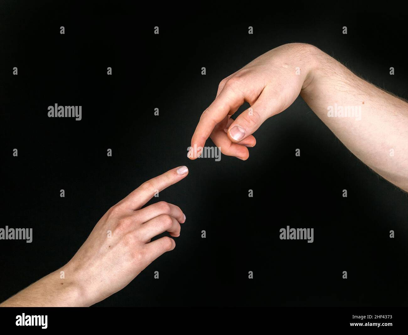 Fingers of Two People Nearly Touching - Isolated Stock Photo - Alamy