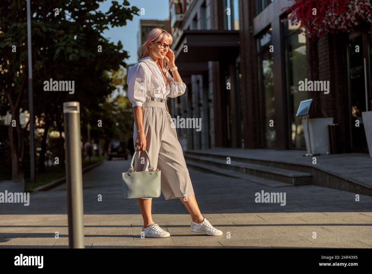 Stylish young woman standing hi-res stock photography and images - Alamy