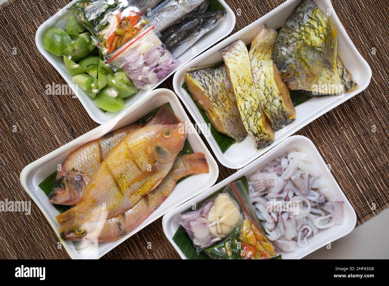 Variety of fish protein sources wrapped in polyethylene foam packaging ...