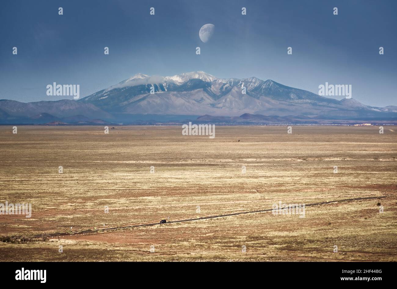 Moon over desert mountain landscape Stock Photo - Alamy