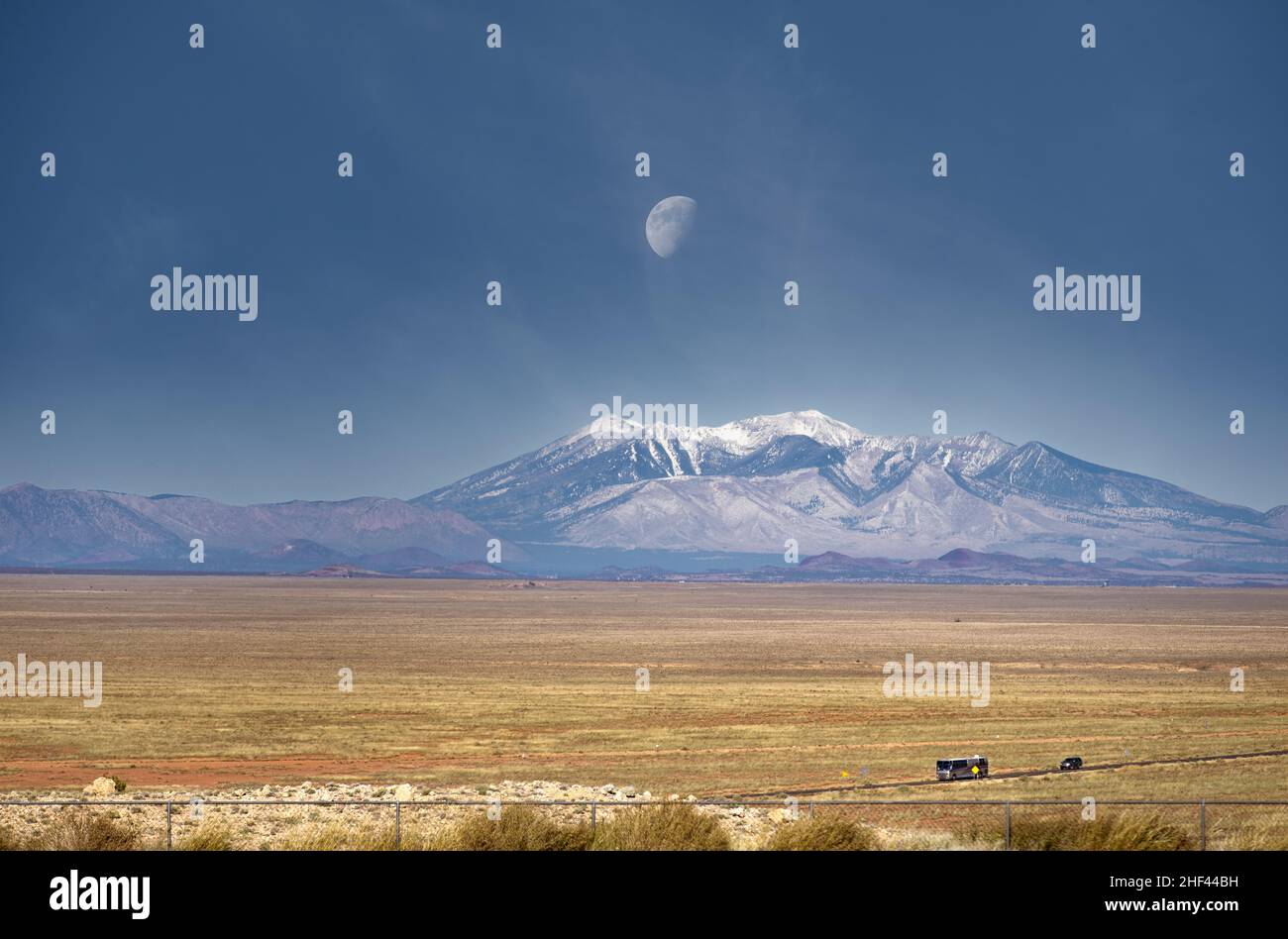 Moon over desert mountain landscape Stock Photo - Alamy