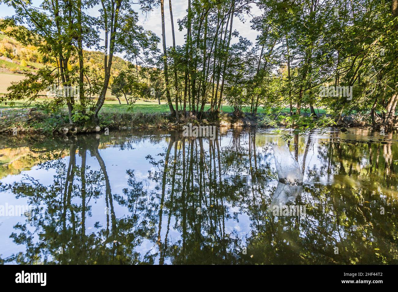 reflection in the river Tauber in lovely Tauber valley near Rothenburg ...