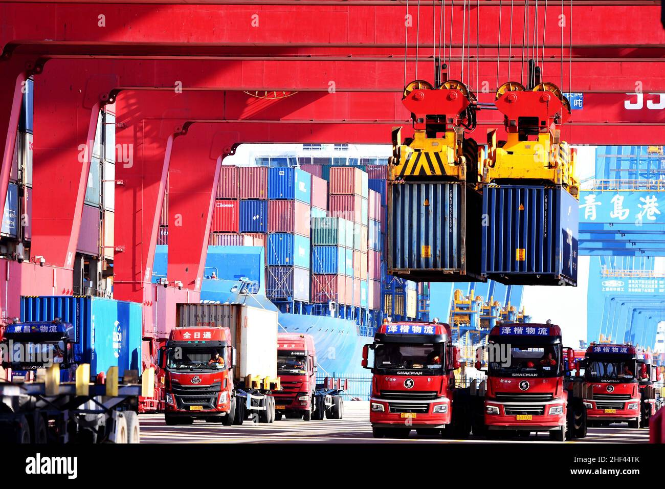 QINGDAO, CHINA - JANUARY 14, 2022 - Cargo ships load and unload ...