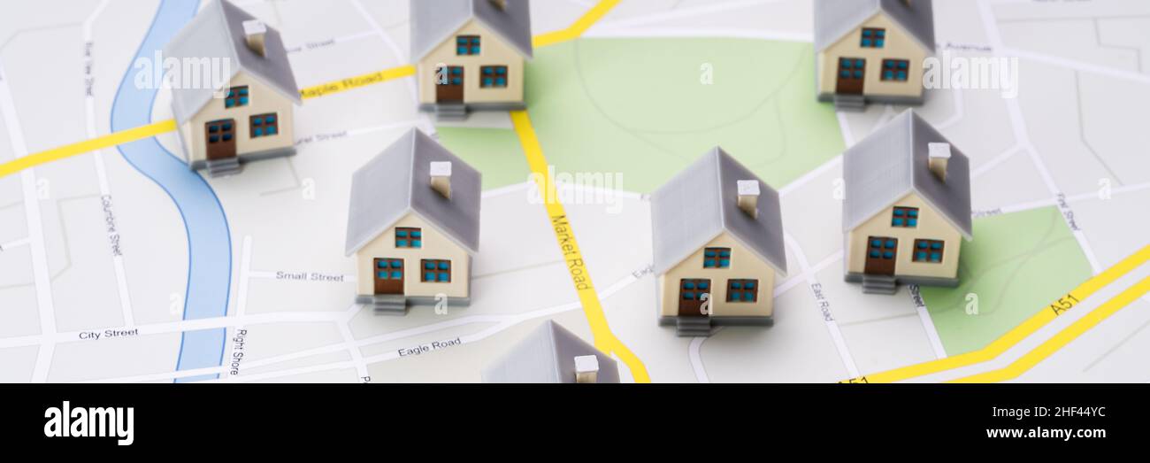 High Angle View Of Small House Models Over Road Route Map Stock Photo ...