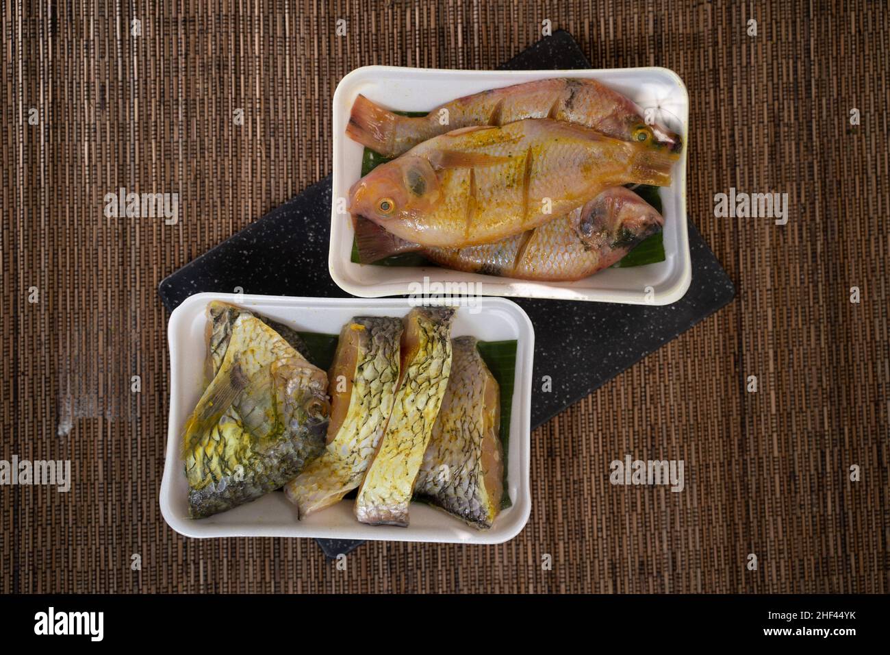 Large and small pieces of fish in polyethylene polymer packaging Stock ...