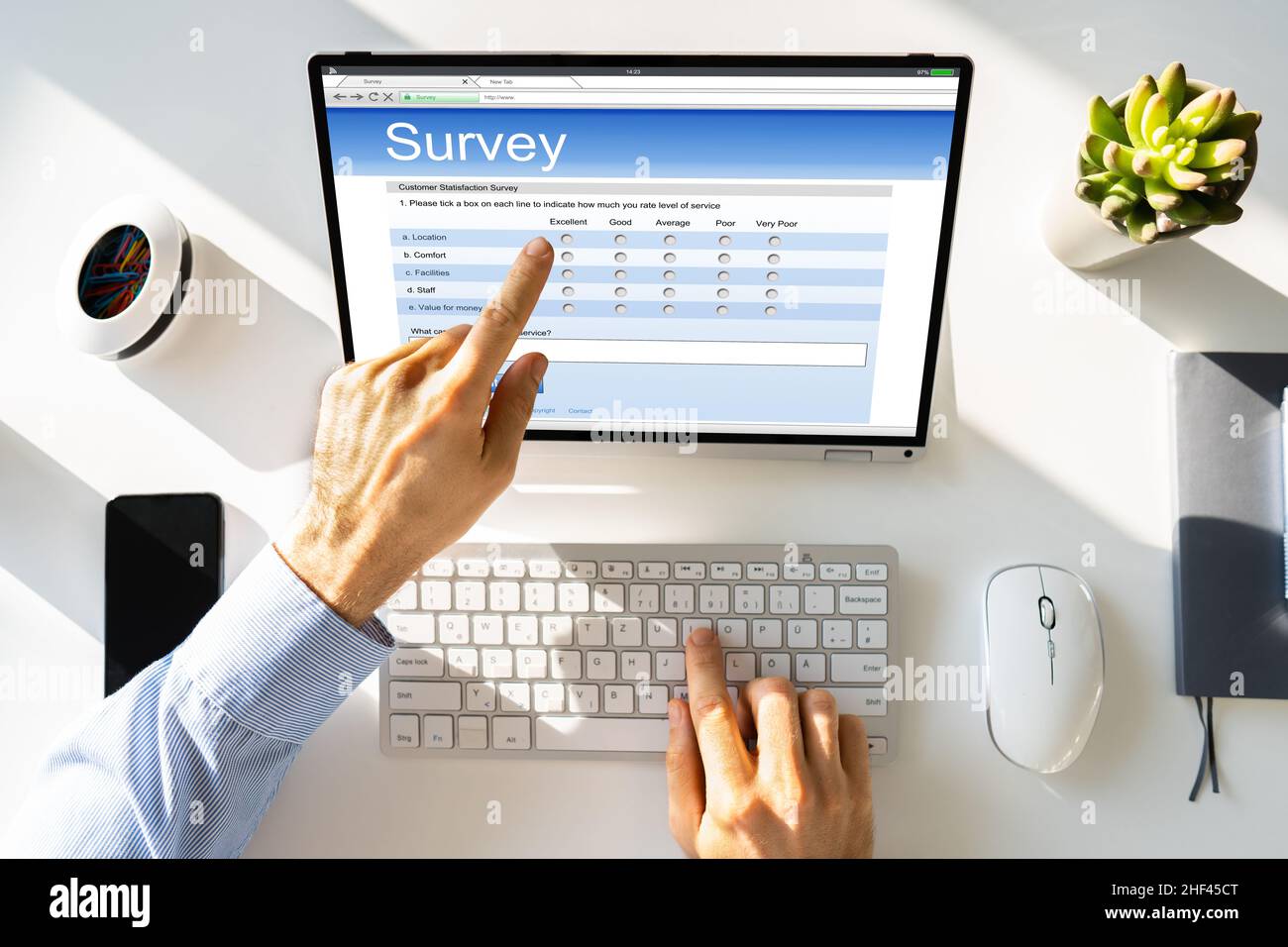 Businessperson Filling Online Survey Form On Digital Laptop Stock Photo ...