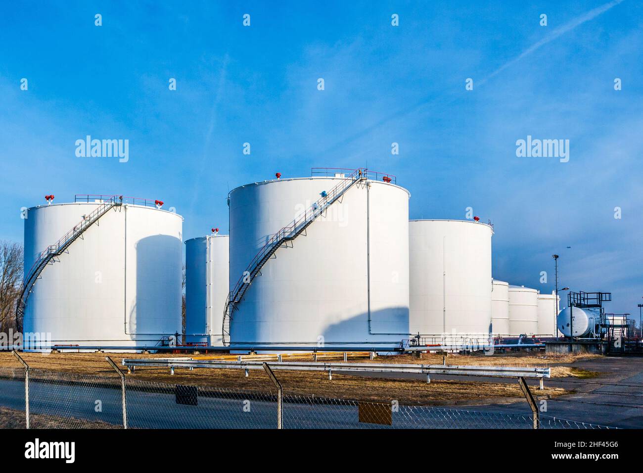 white tanks in tank farm with blue sky Stock Photo - Alamy