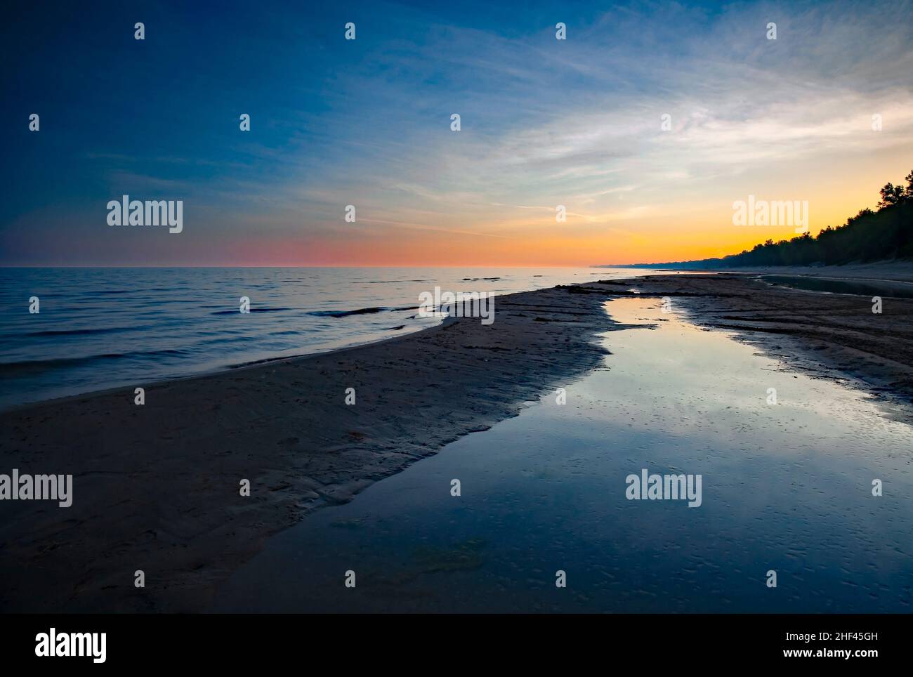 A sandbar at sunset off shore on Lake Erie at Long Point Poinr ...