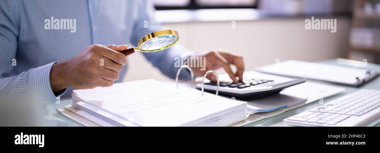Auditor Using Magnifying Glass For Audit And Fraud Investigation Stock ...