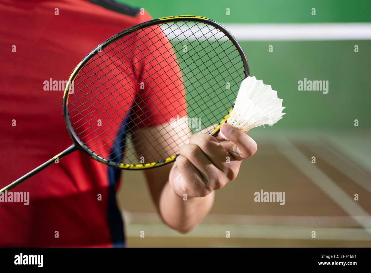 Close up of badminton player's hand holding racket and shuttle Stock ...