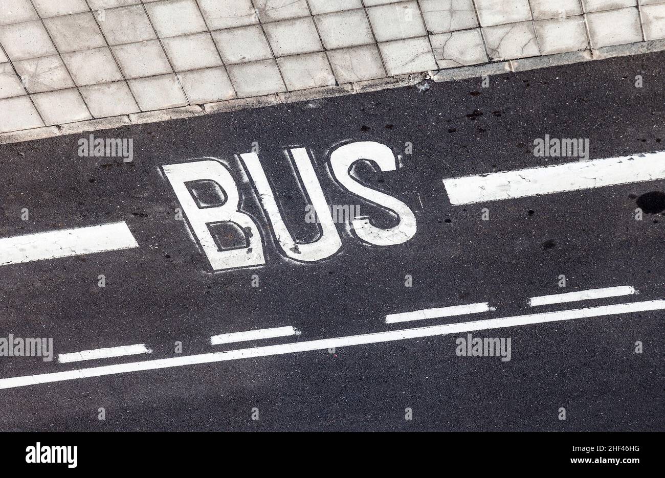 bus stop sign painted on the asphalt Stock Photo - Alamy