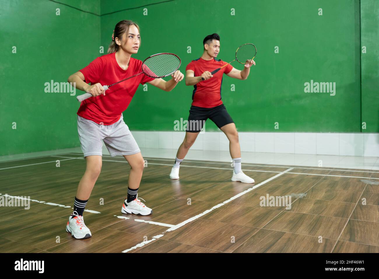 Mixed doubles badminton player with stance position ready to play Stock ...