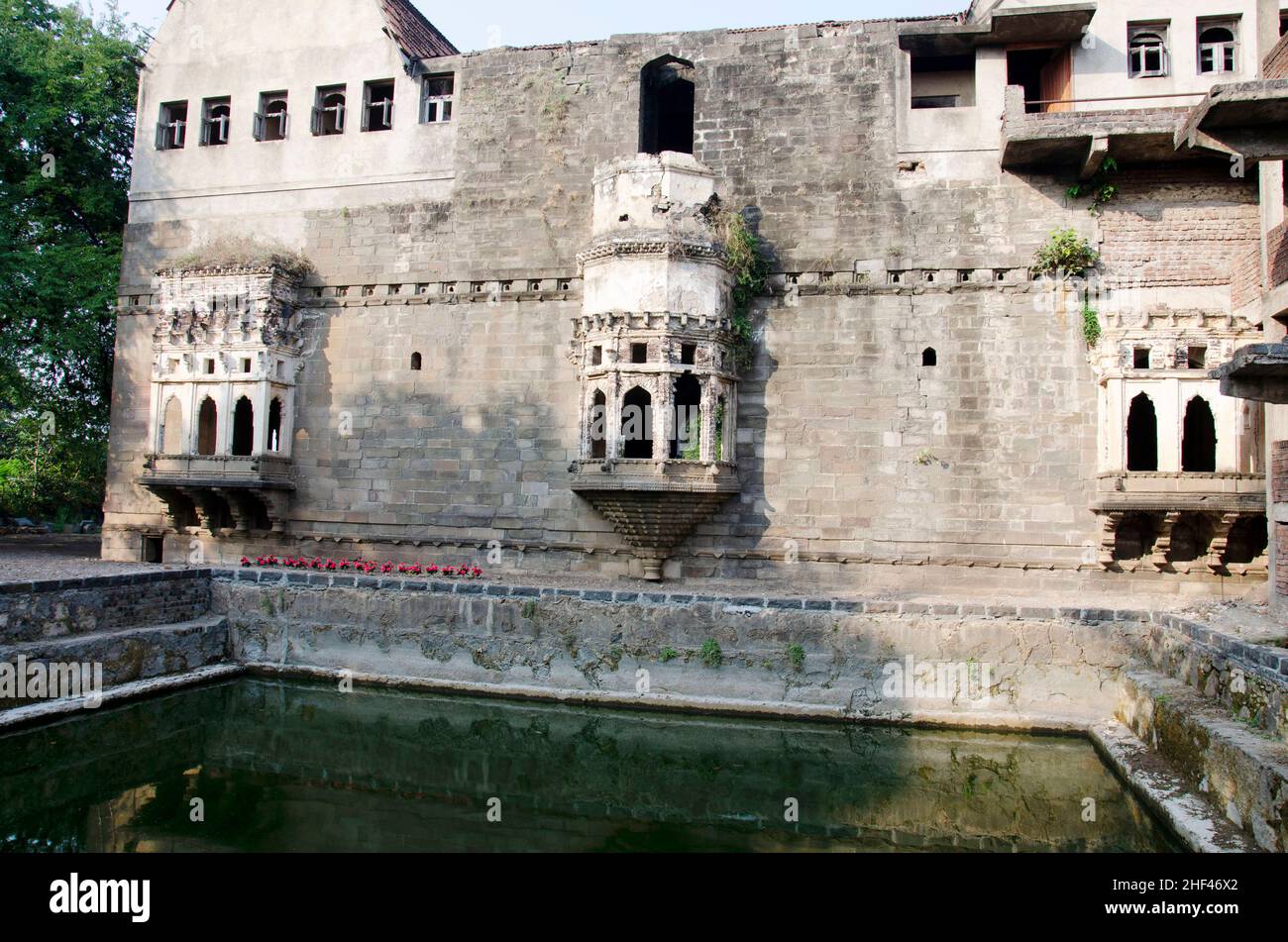 Small pond with an outer view of the Habashi Mahal, also know as Malik ...