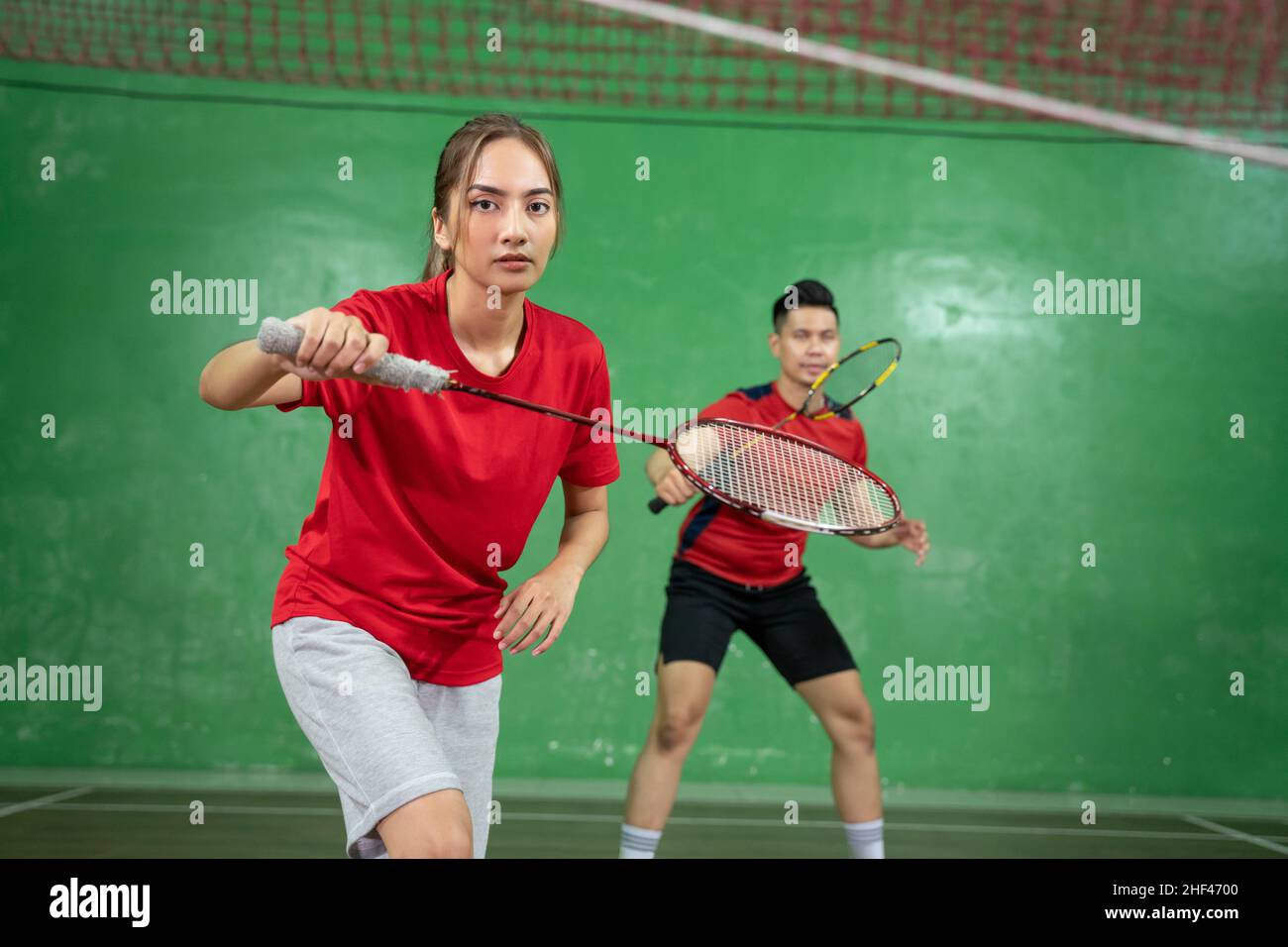 Beautiful badminton player looking at camera with a ready stance Stock ...