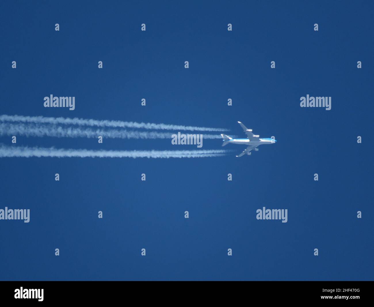 Telephoto close-up of a KLM Boeing 747 airliner flying towards ...