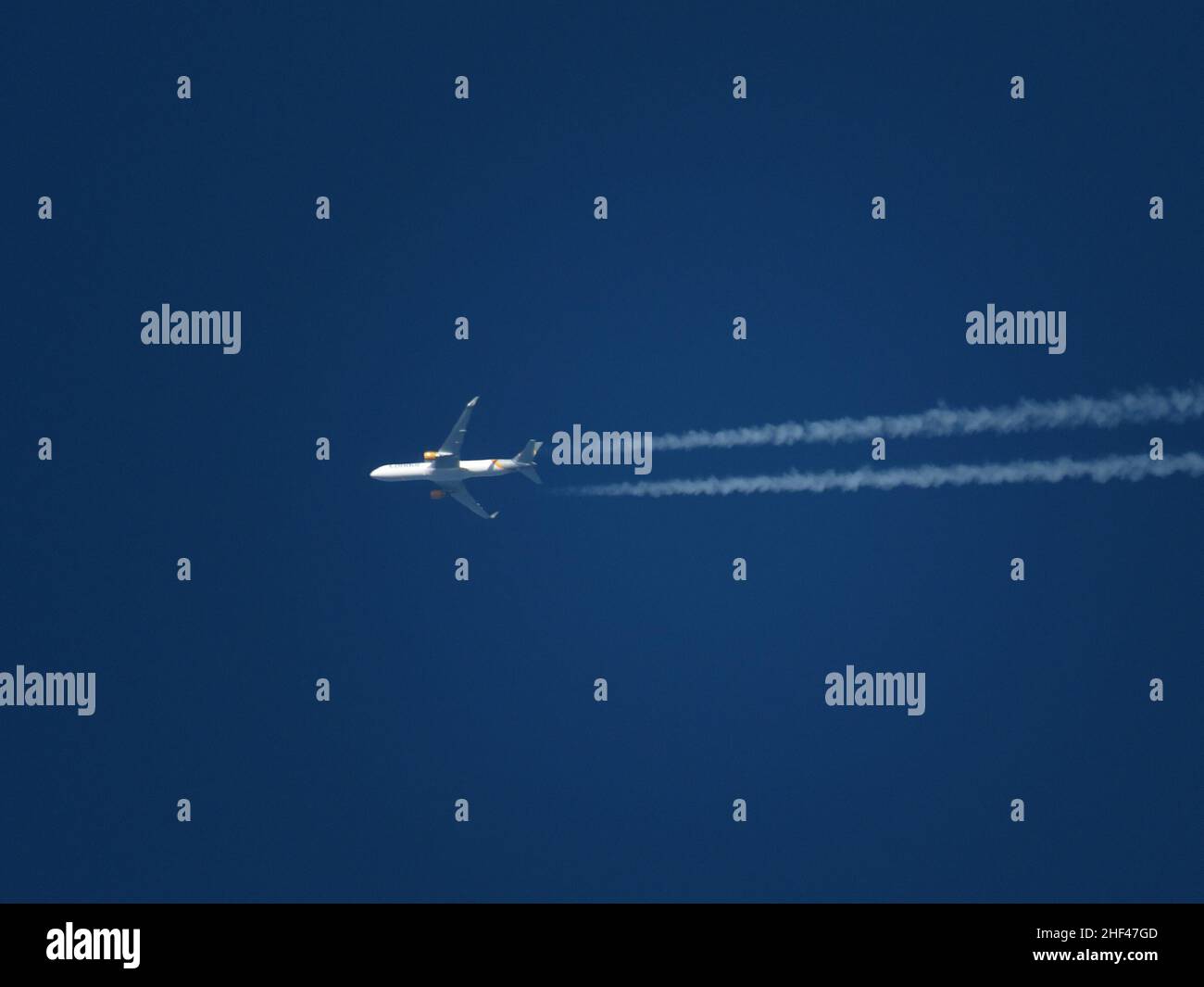 Tele view of Condor airlines aircraft flying at high altitude with ...
