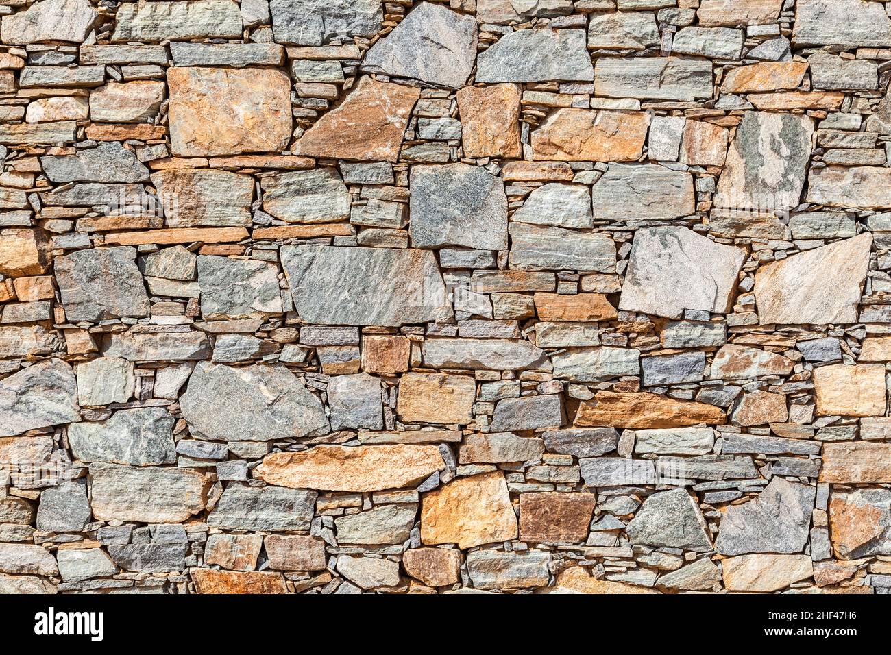 old stone wall made of natural stones Stock Photo - Alamy