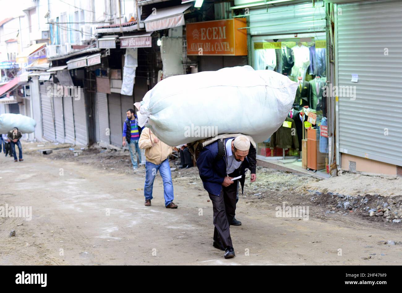 A Turkish man carrying goods on his back Stock Photo - Alamy