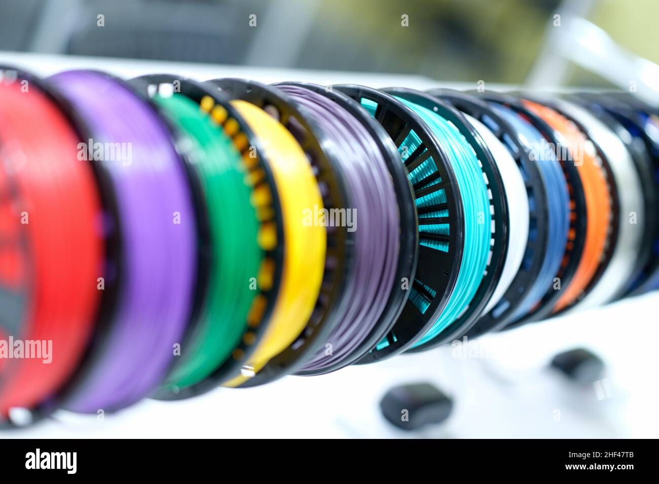 Coils of bright wire, close-up, blurry. A set of flexible electrical ...