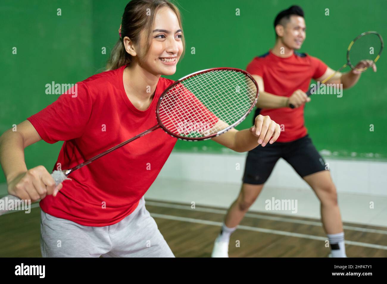 Mixed doubles badminton player with stance position ready to play Stock ...