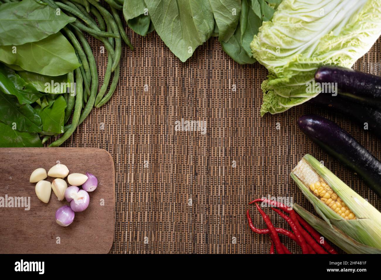 Fresh vegetables on a brown textured base Stock Photo - Alamy