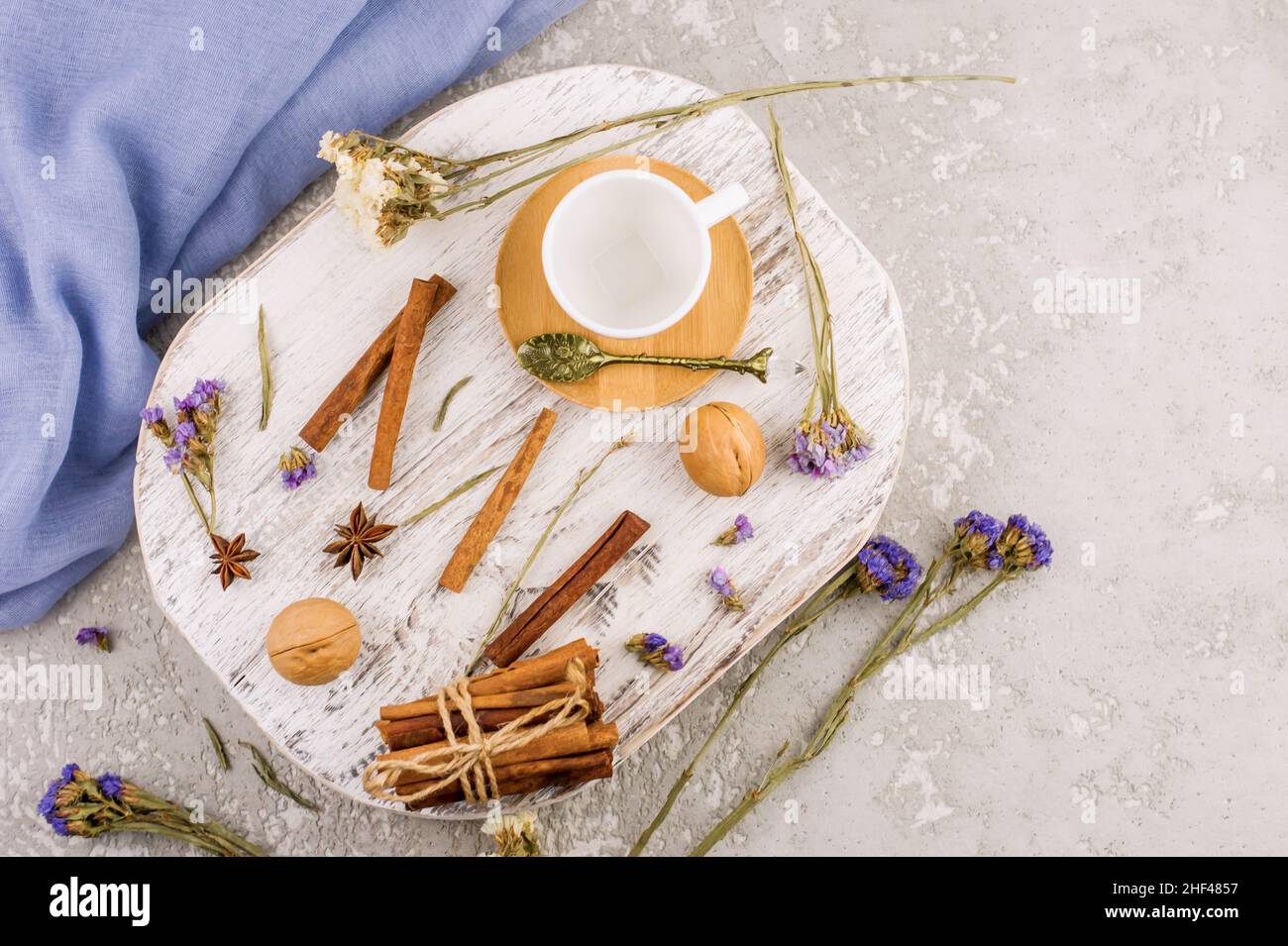 top view of a white wooden podium with an empty coffee cup, cinnamon ...