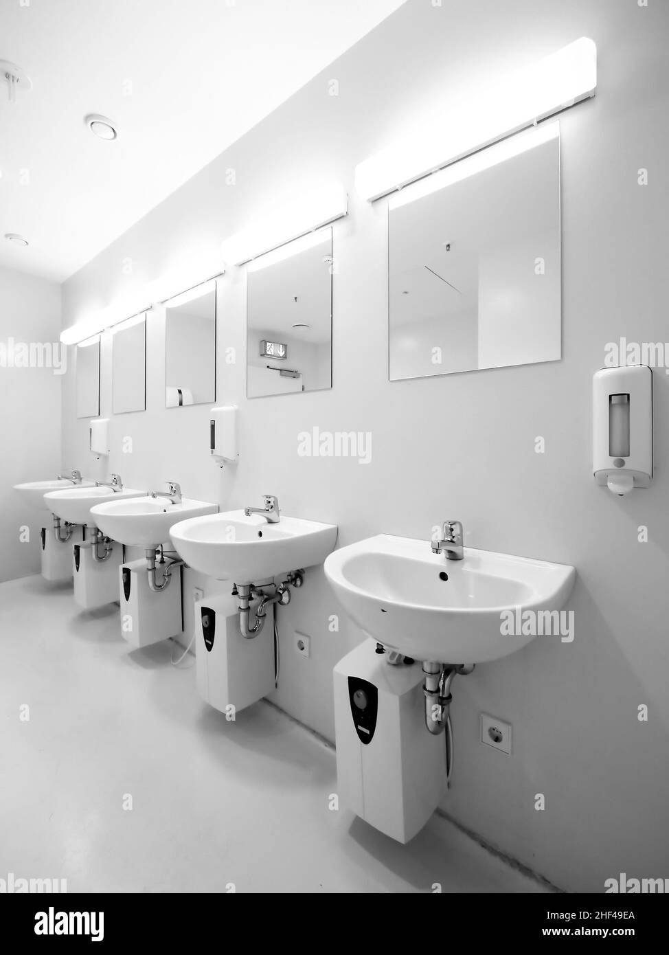 a clean new public toilet room empty Stock Photo - Alamy