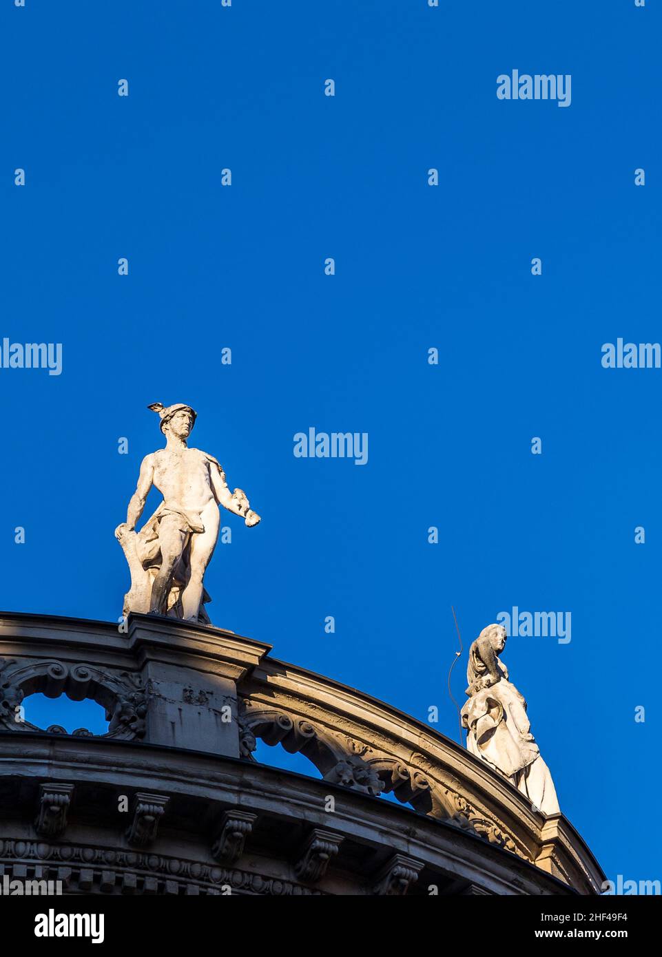 sandstone statues in classicism style at the roof of an old building at ...