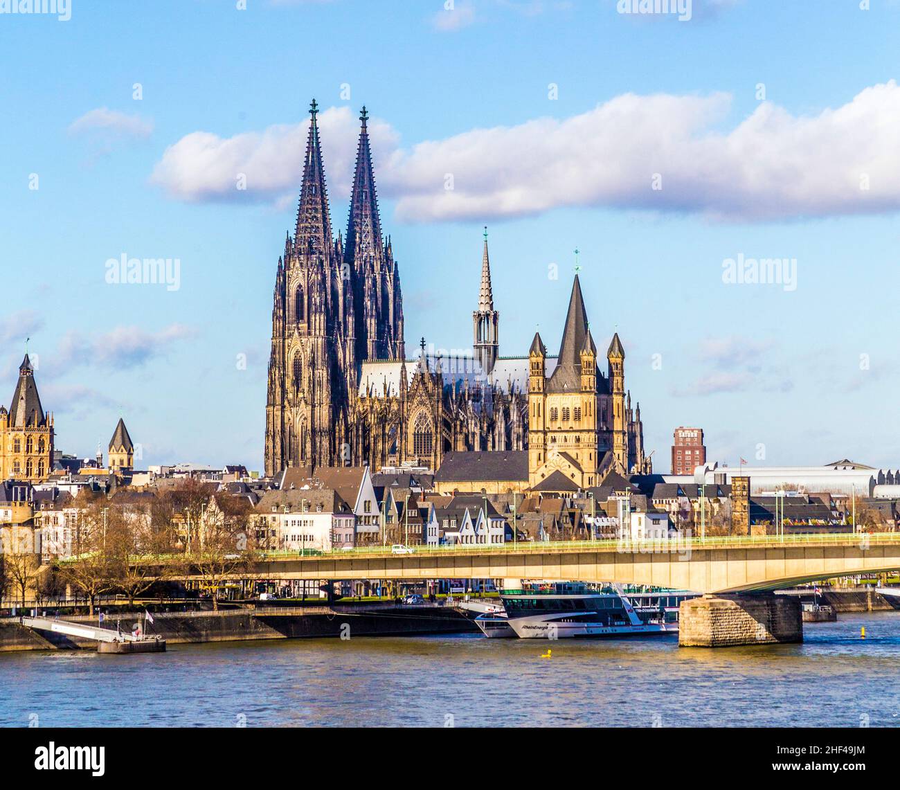 Cologne skyline with dome and bridge under blue sky Stock Photo - Alamy