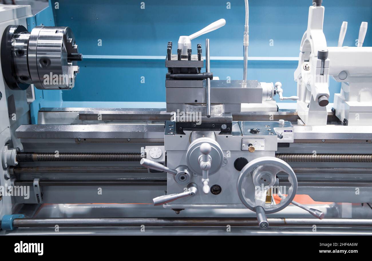 Metalworking. Close-up of lathe turning machine in industrial factory ...