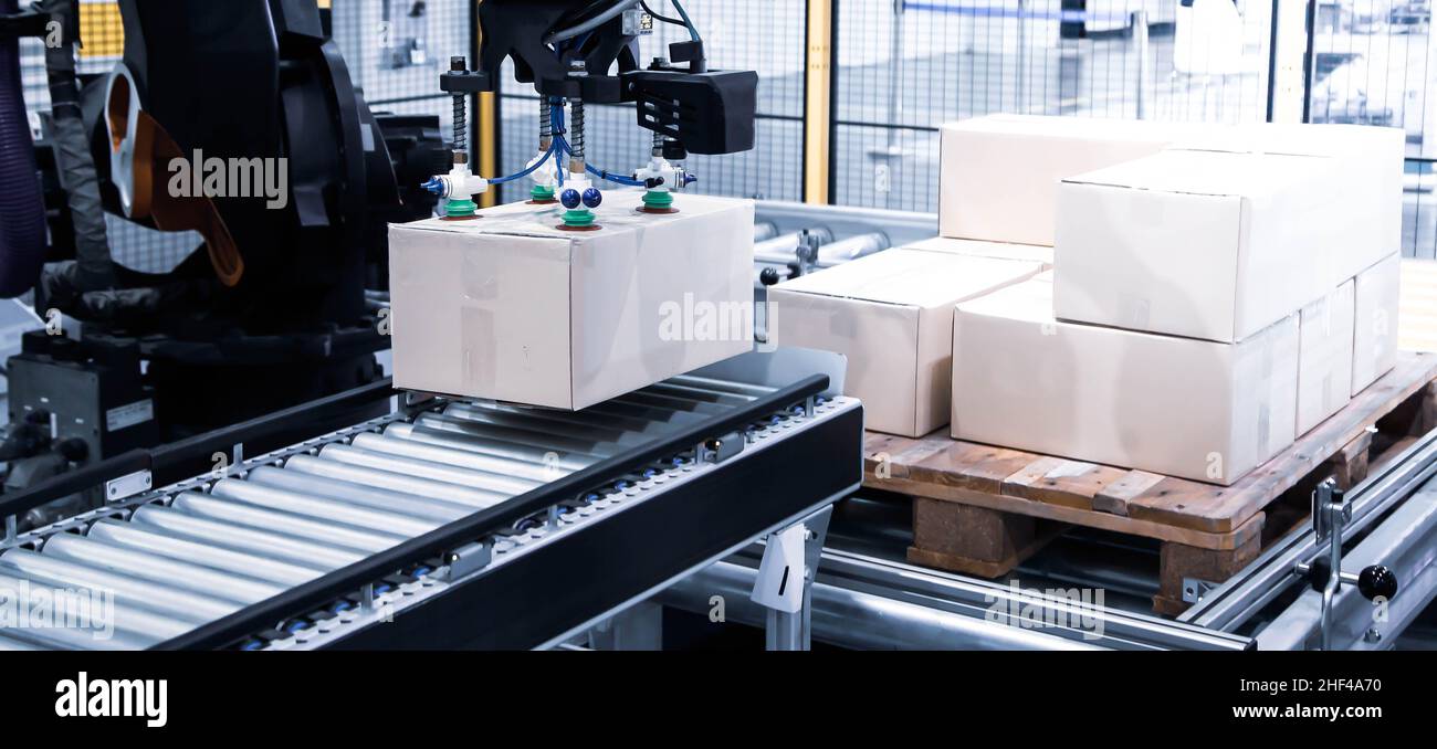 Smart logistic industry. Industrial autonomous robot loading carton on ...