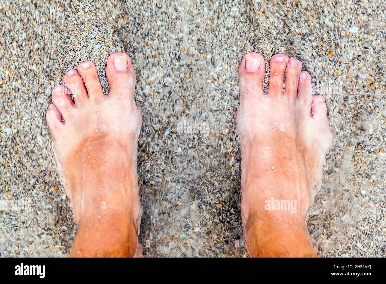 feet of man at the beach with water Stock Photo - Alamy
