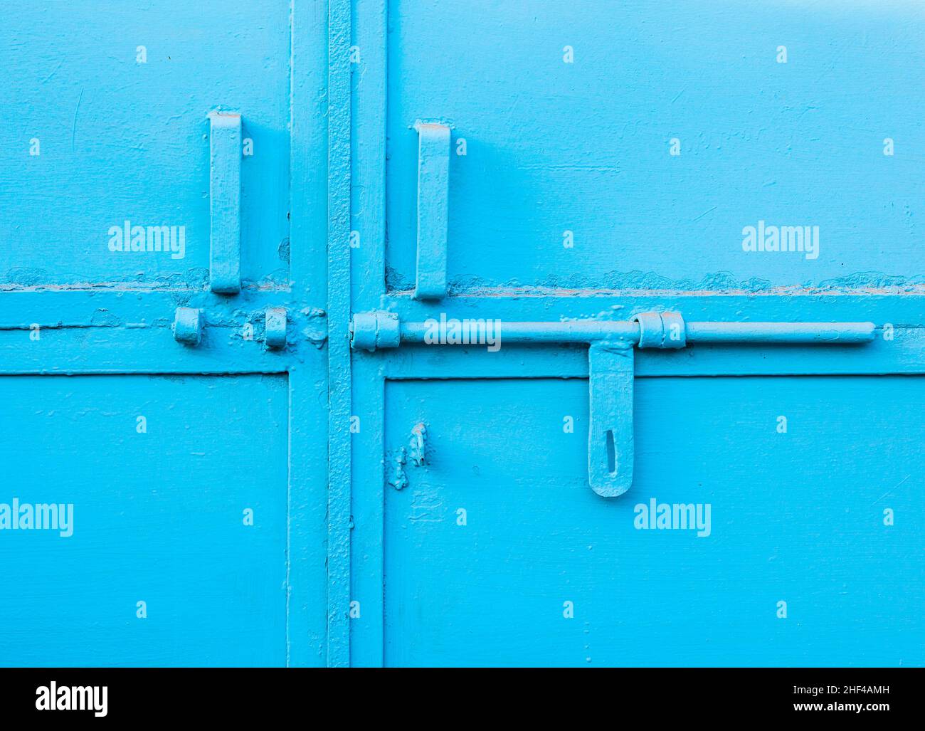 outdoor view at blue iron gate Stock Photo - Alamy