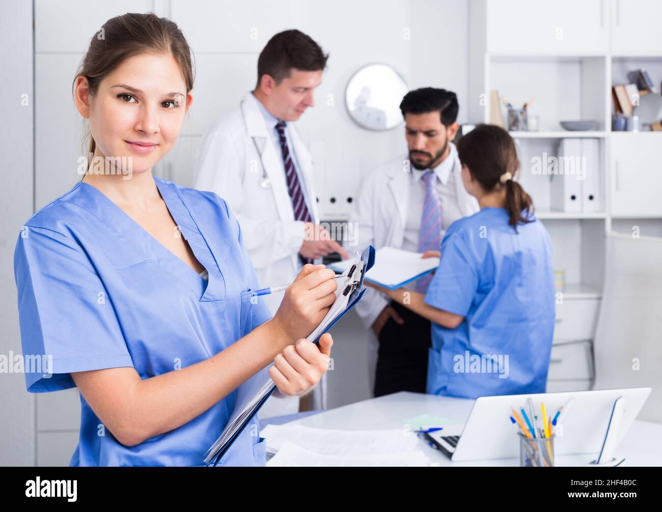 Doctor assistant noting prescriptions Stock Photo - Alamy