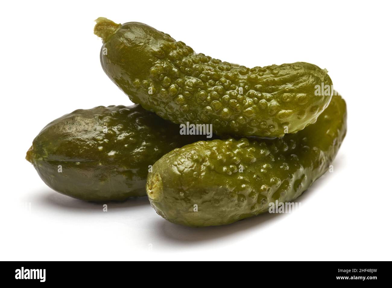 Tasty canned Whole green cornichons isolated on a white background ...