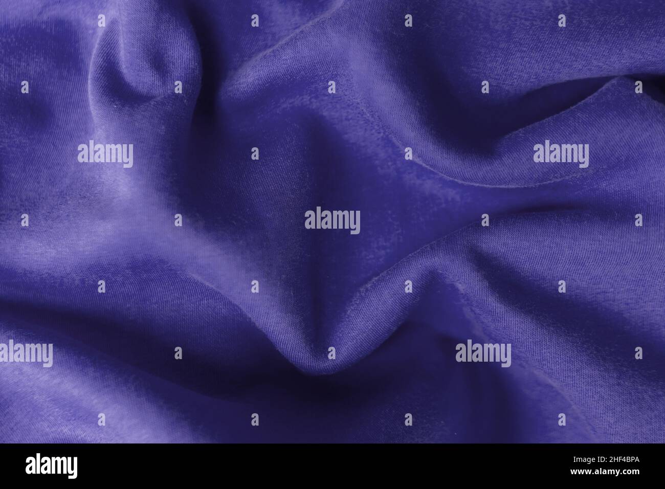 Fabric with waves colored in violet color of the year 2022. Trendy ...