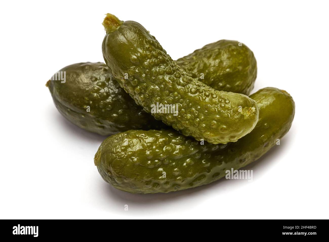 Tasty canned Whole green cornichons isolated on a white background ...