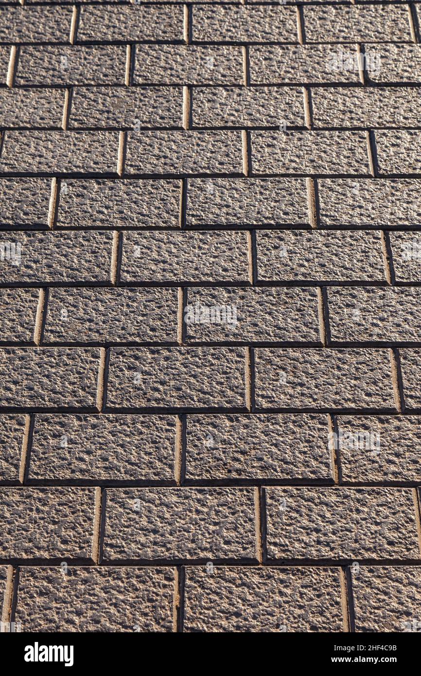 textured floor tiles with bright sun reflections Stock Photo - Alamy