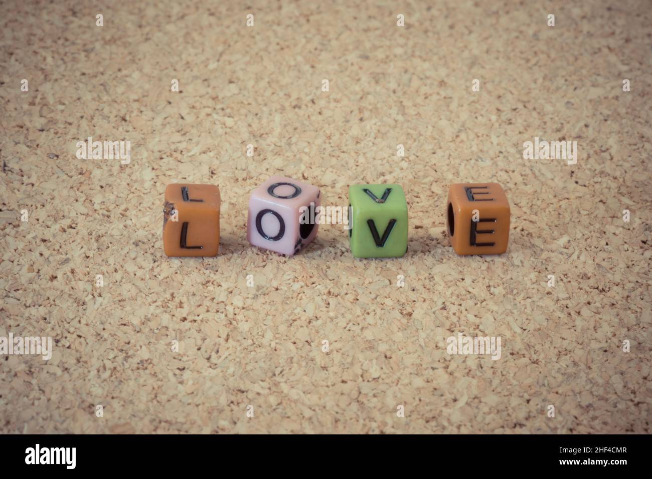 Letters love on cork board background Stock Photo - Alamy