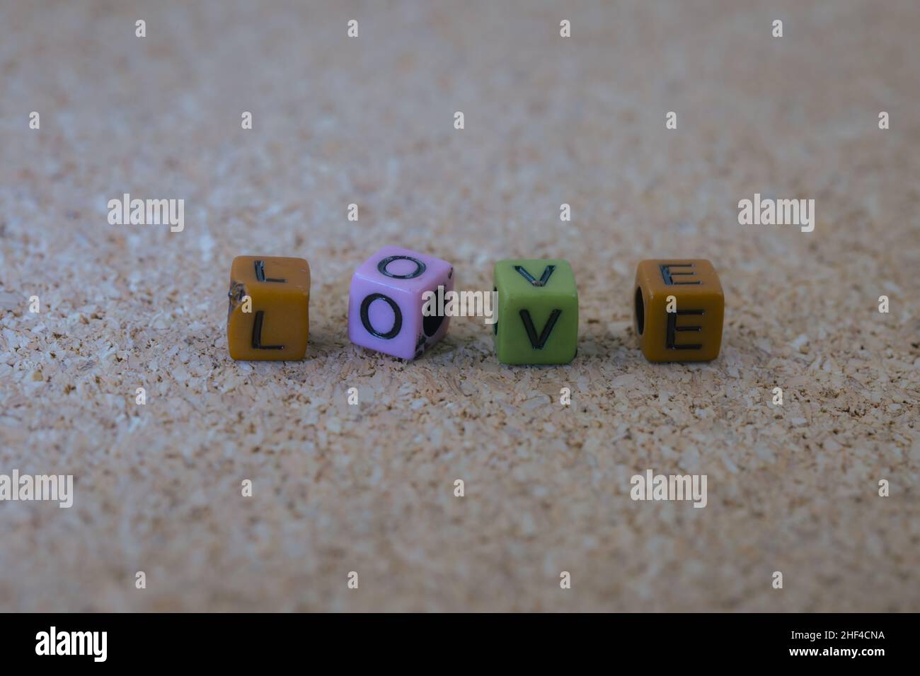 Letters love on cork board background Stock Photo - Alamy