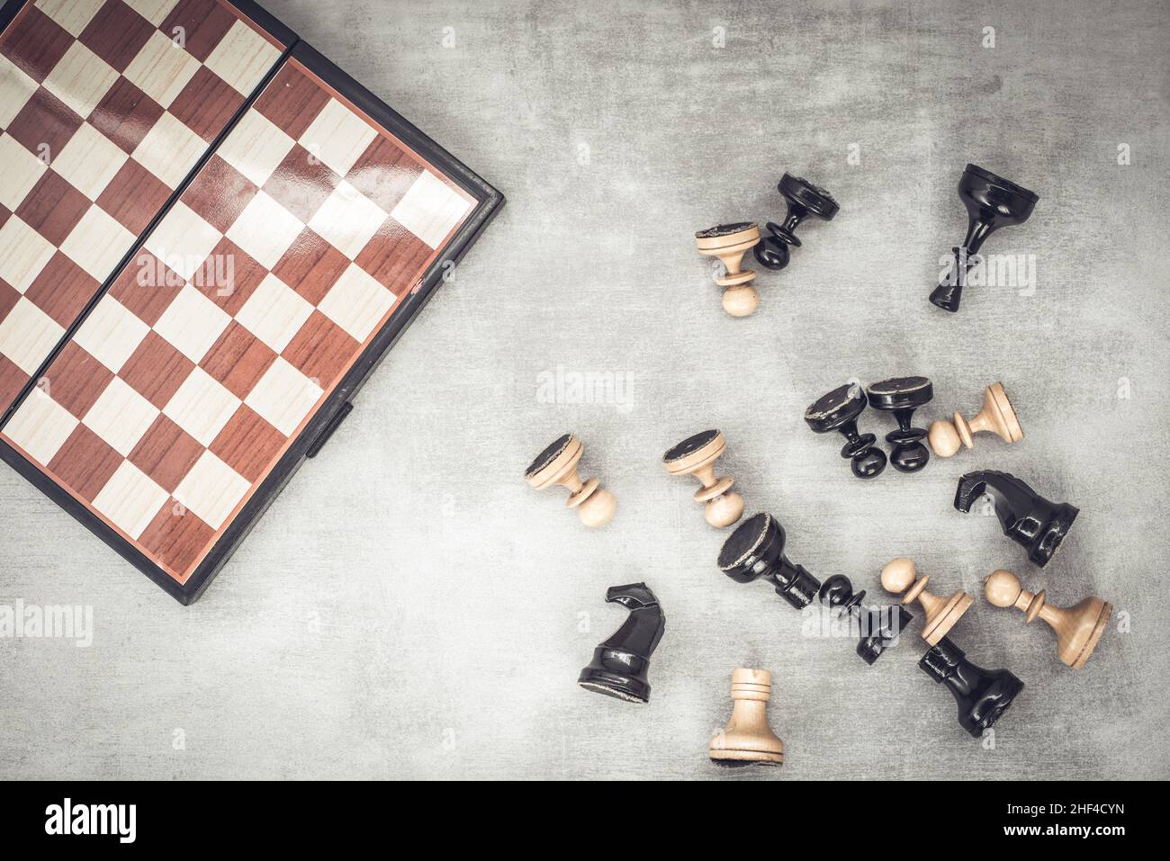 Chessboard and scattered chess pieces, top view Stock Photo - Alamy