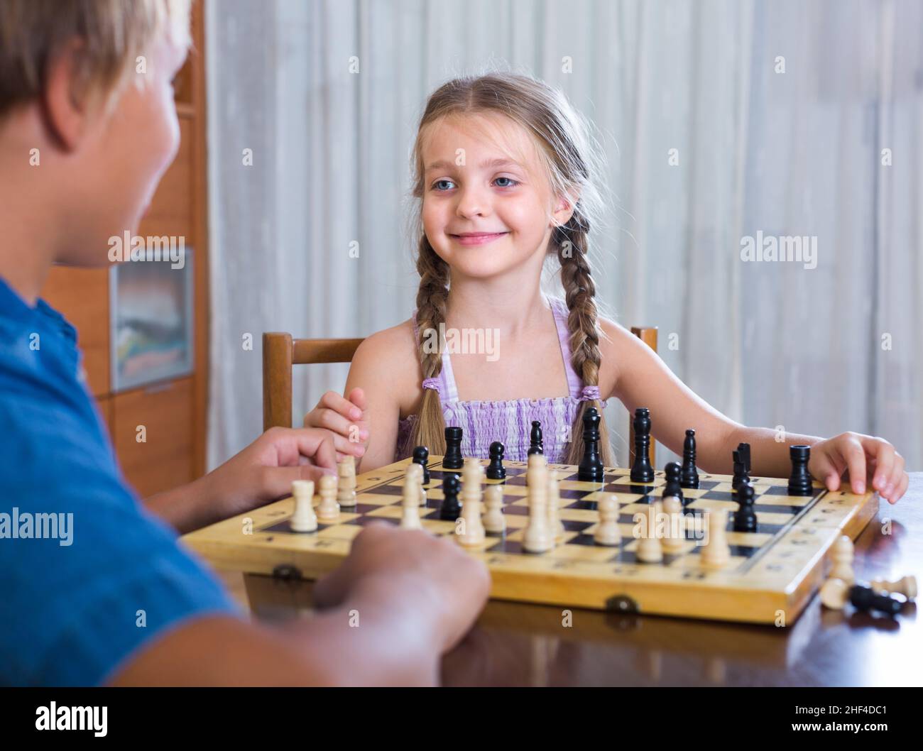 Children playing chess at home Stock Photo - Alamy