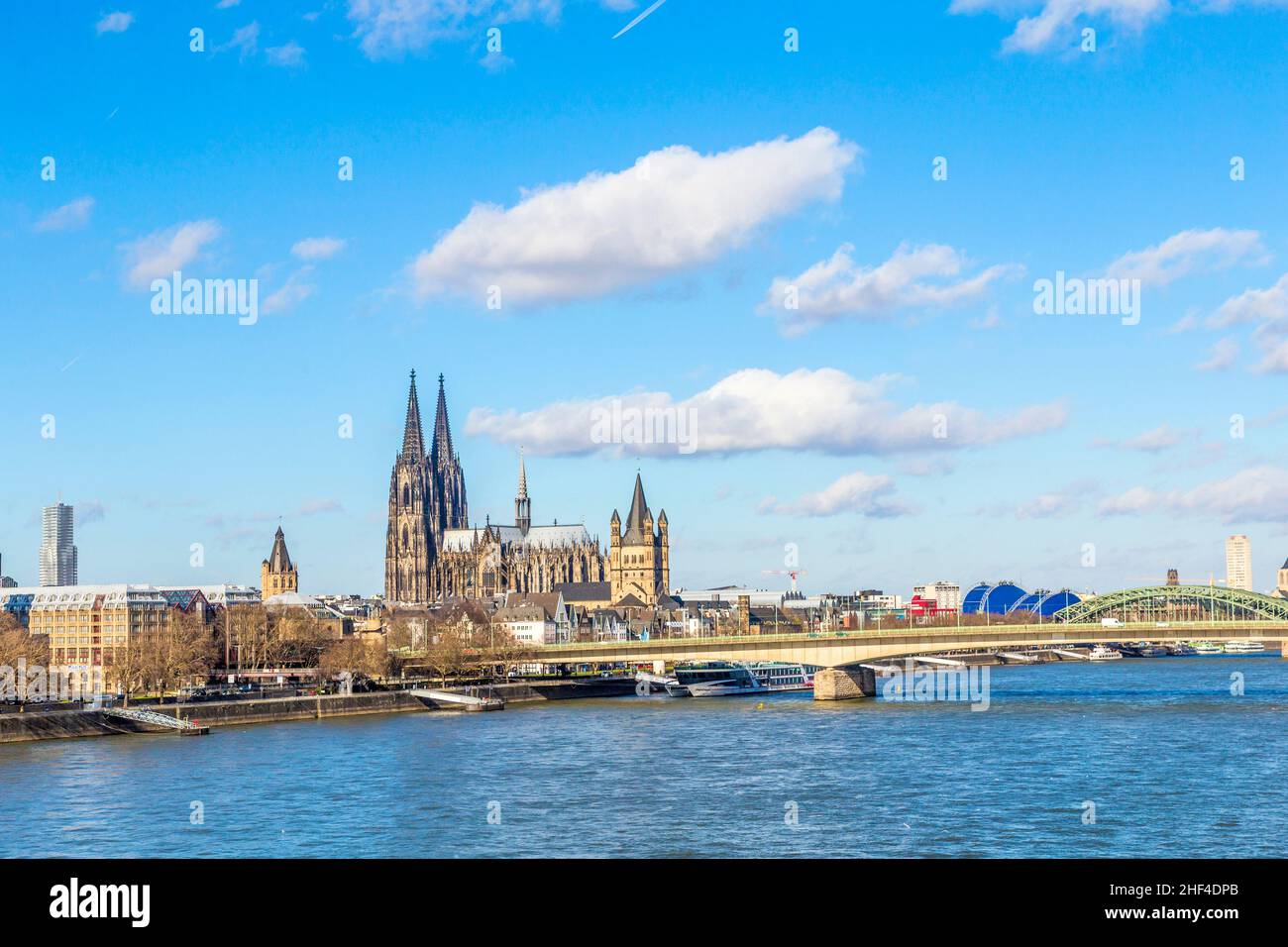 Cologne skyline with dome and bridge under blue sky Stock Photo - Alamy