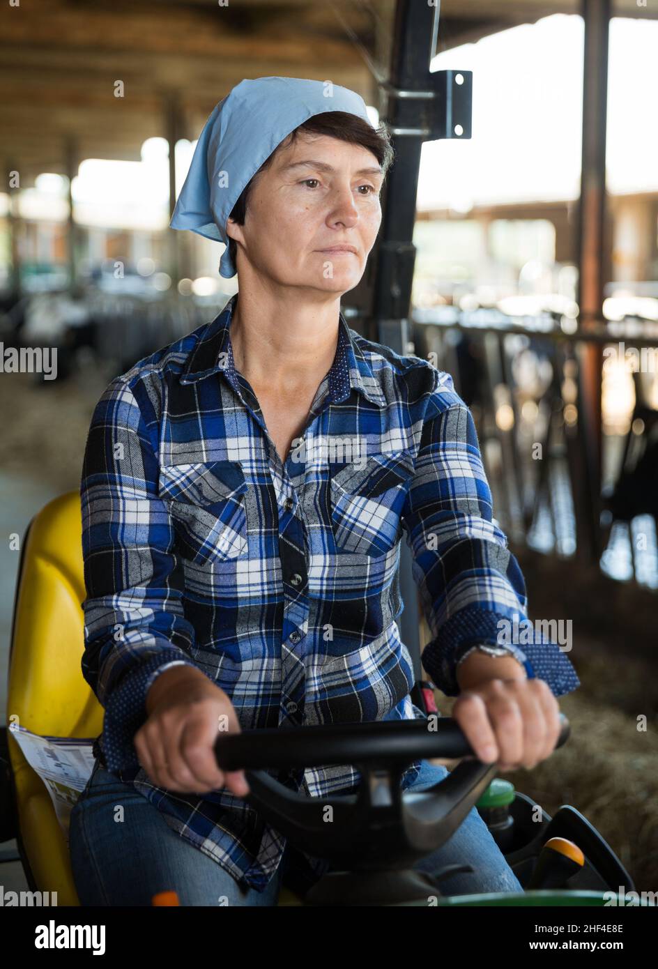 Woman driving tractor farm cabin hi-res stock photography and images ...
