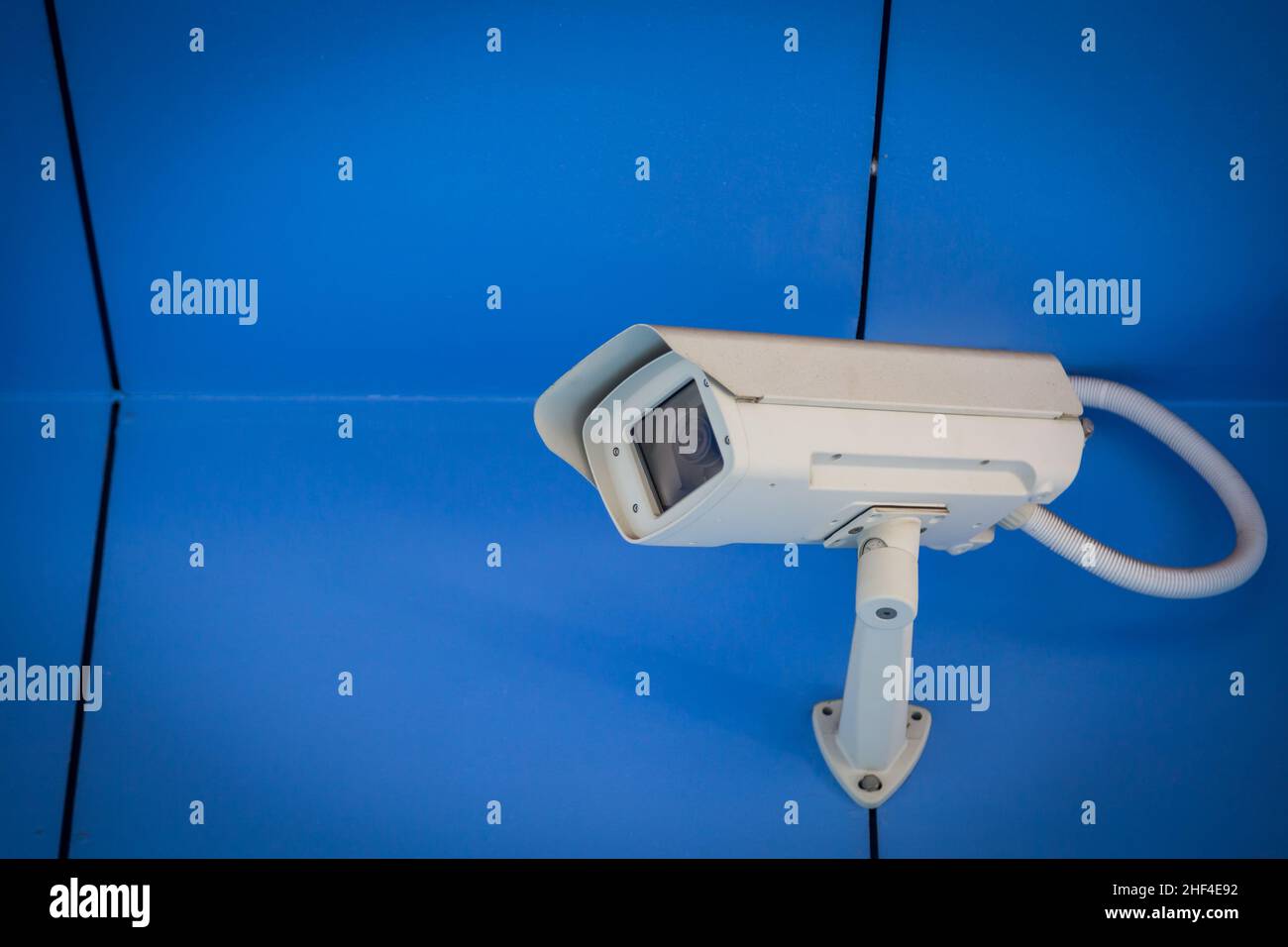 Security CCTV camera in office building background Stock Photo - Alamy