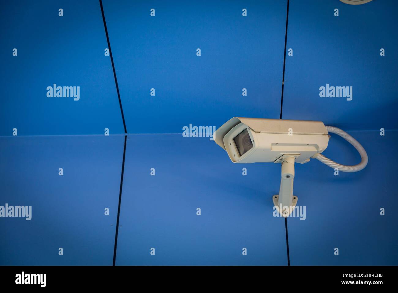 Security CCTV camera in office building background Stock Photo - Alamy