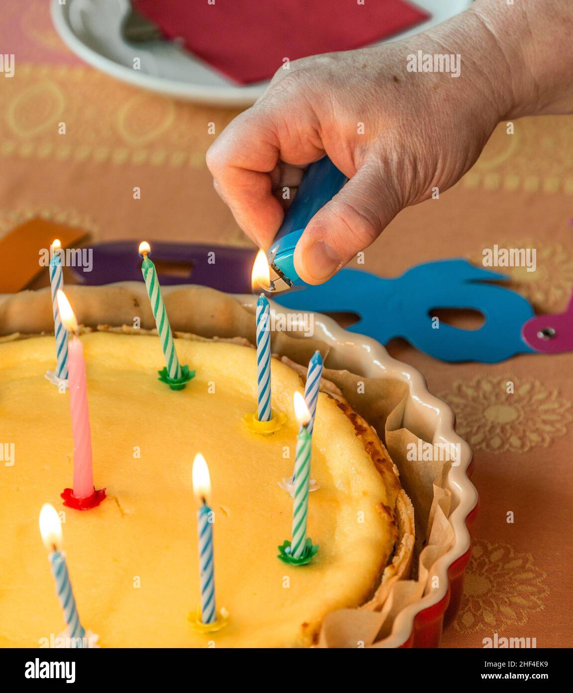 birthday cake with lots of candles at the table Stock Photo - Alamy