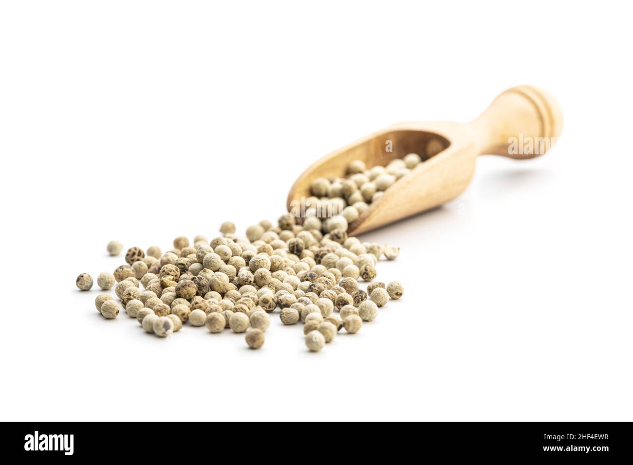 Whole pepper spice in wooden scoop. White peppercorn grain isolated on ...