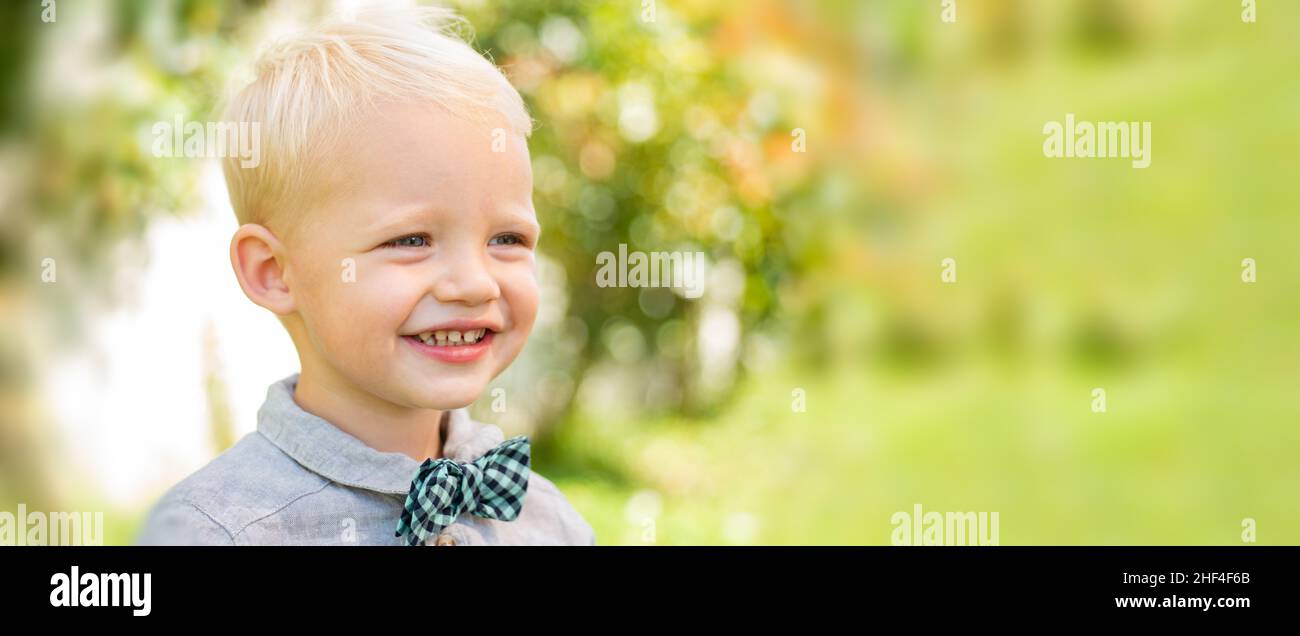 Banner with spring kids portrait. Spring smiling child. Sunny portrait ...